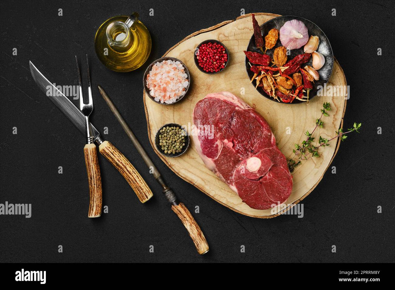 Overhead view of raw lamb center cut leg steak with spice Stock Photo ...