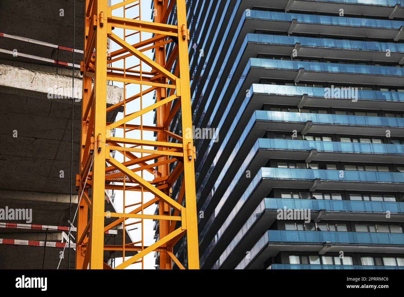 Construction site with tower crane near buildings Stock Photo - Alamy