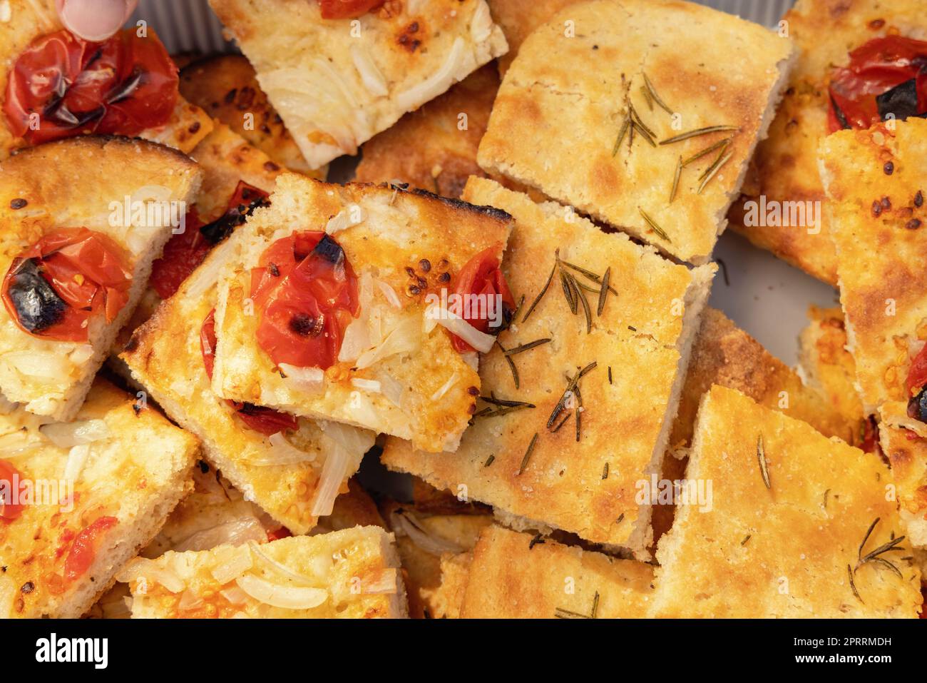 Freshly baked homemade apulian focaccia cut in slices top view. Barese ...