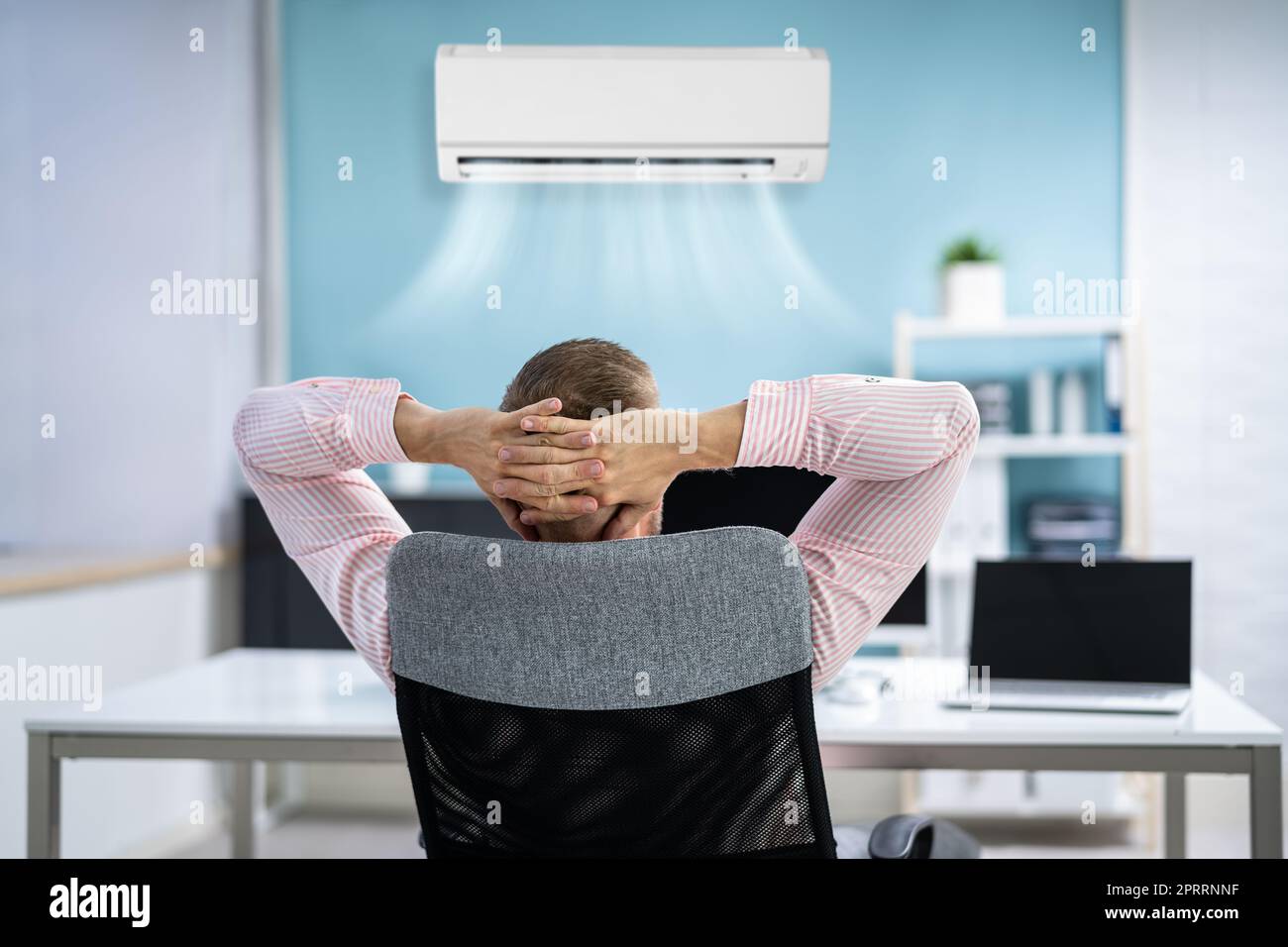 Relaxed Businessman Enjoying The Cooling Of Air Conditioner Stock Photo ...
