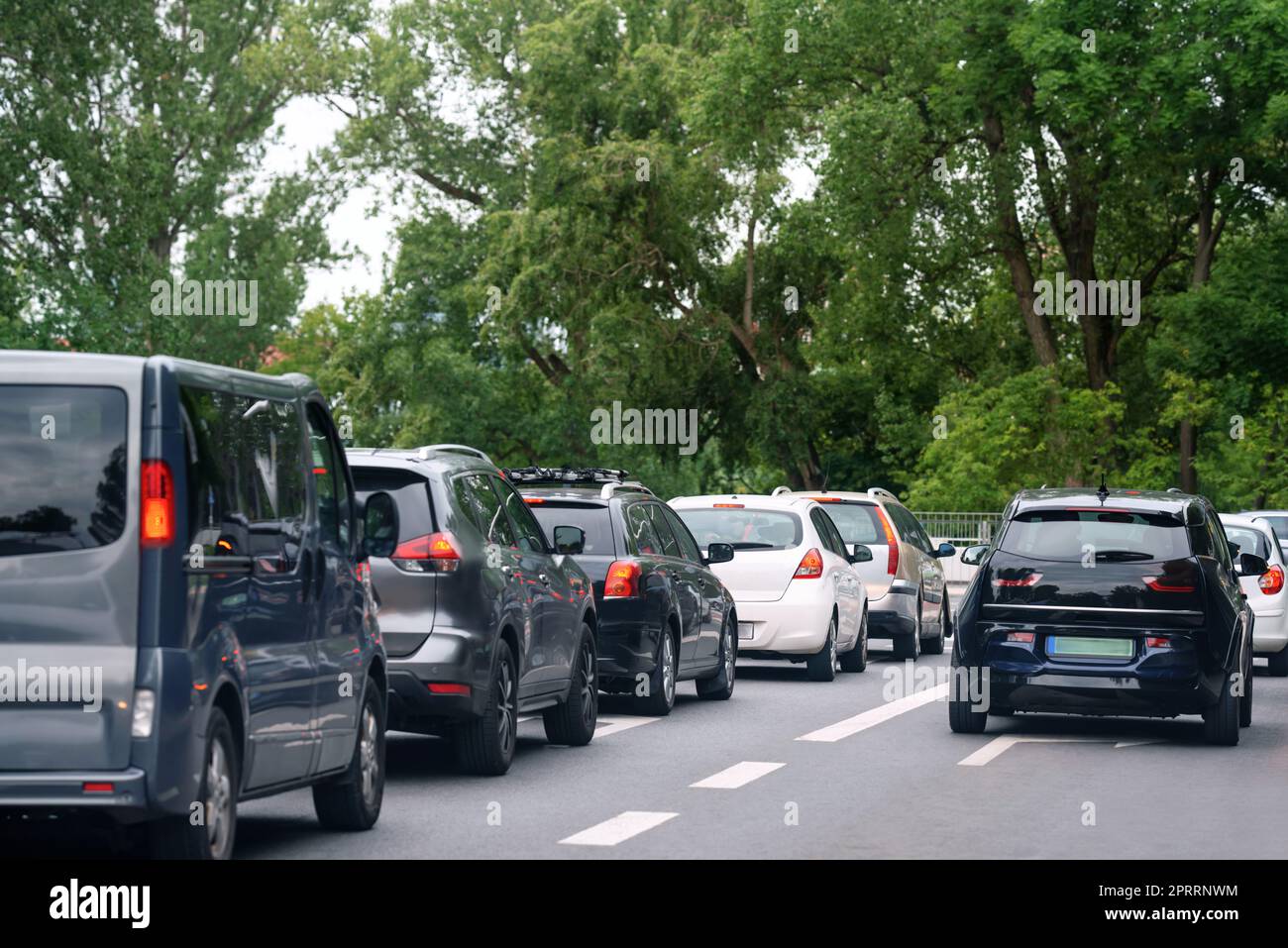 Cars in traffic jam on city street Stock Photo - Alamy