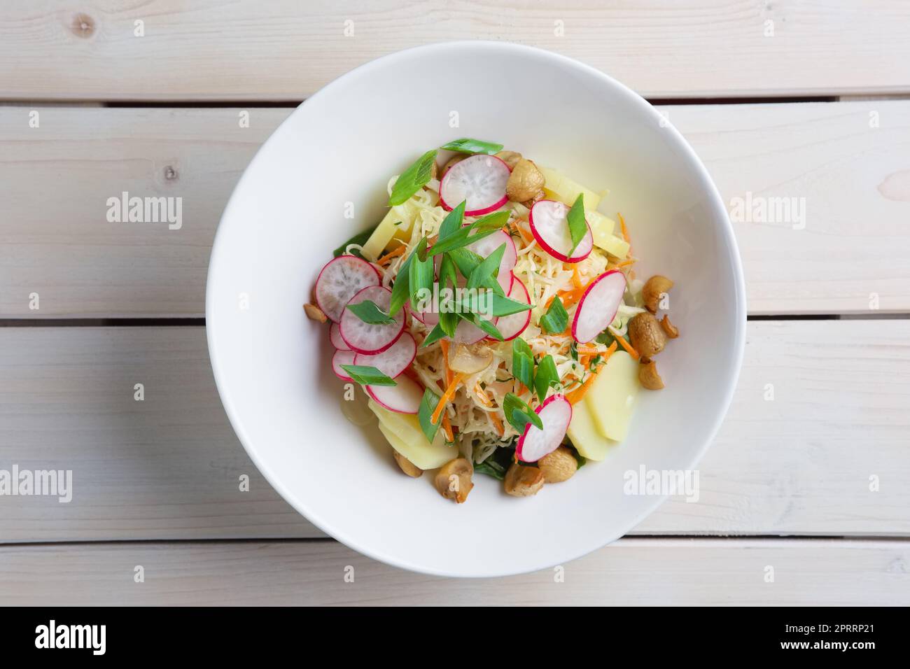 Salad with radish, cabbage, mushroom and potato. Top view Stock Photo ...