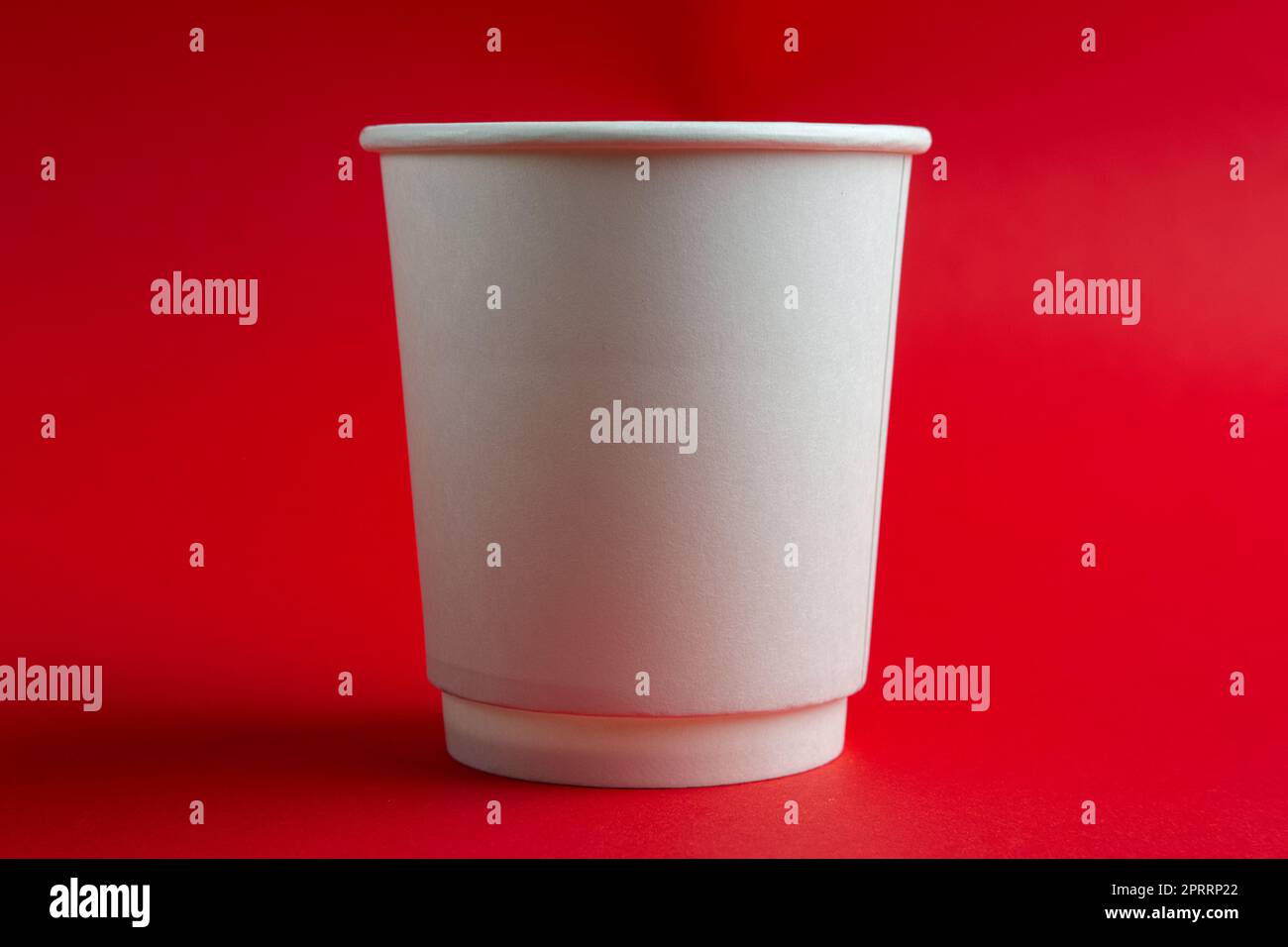 cardboard cup without lid on red background Stock Photo - Alamy