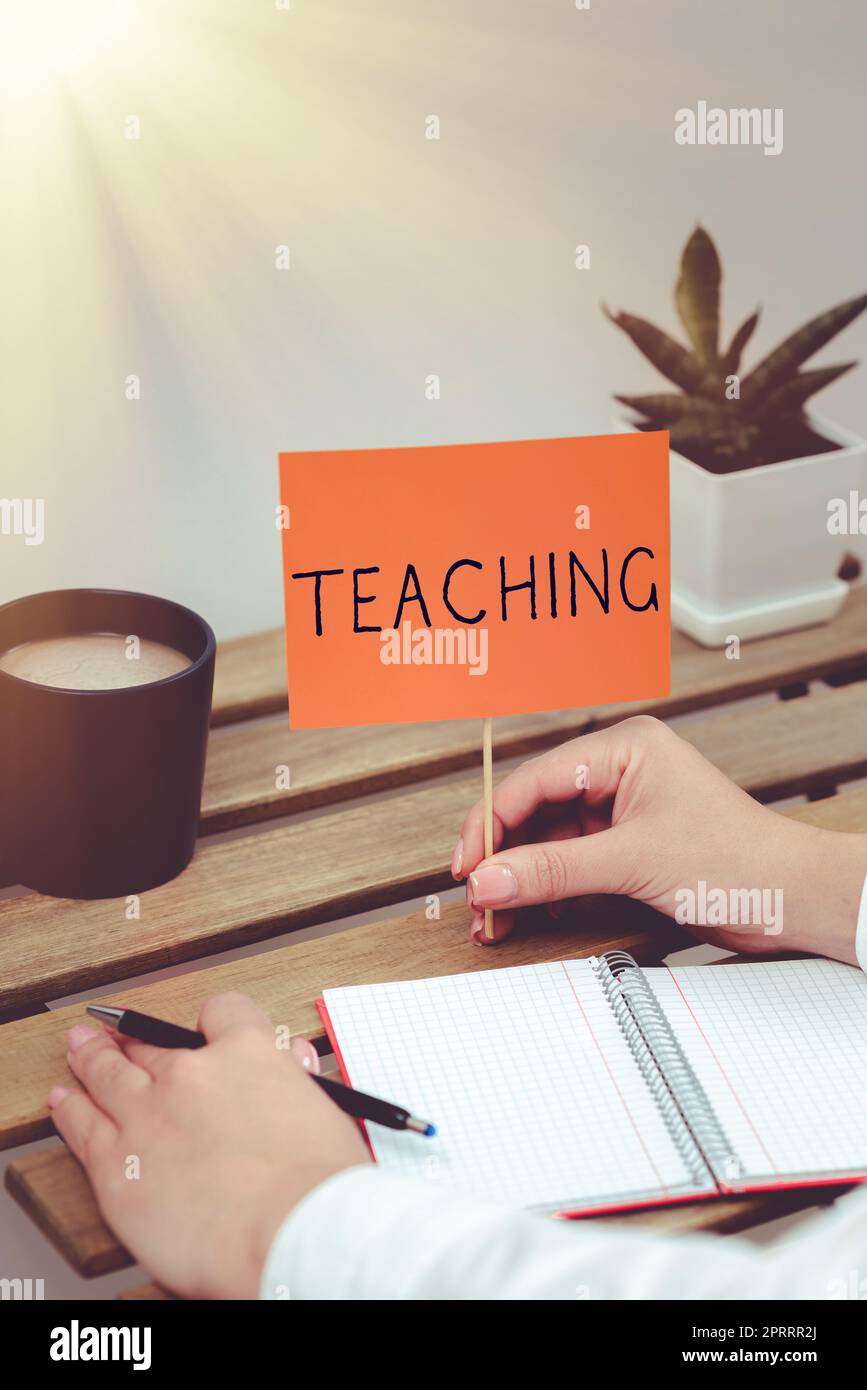 Hand writing sign Teaching. Internet Concept Act of giving information ...