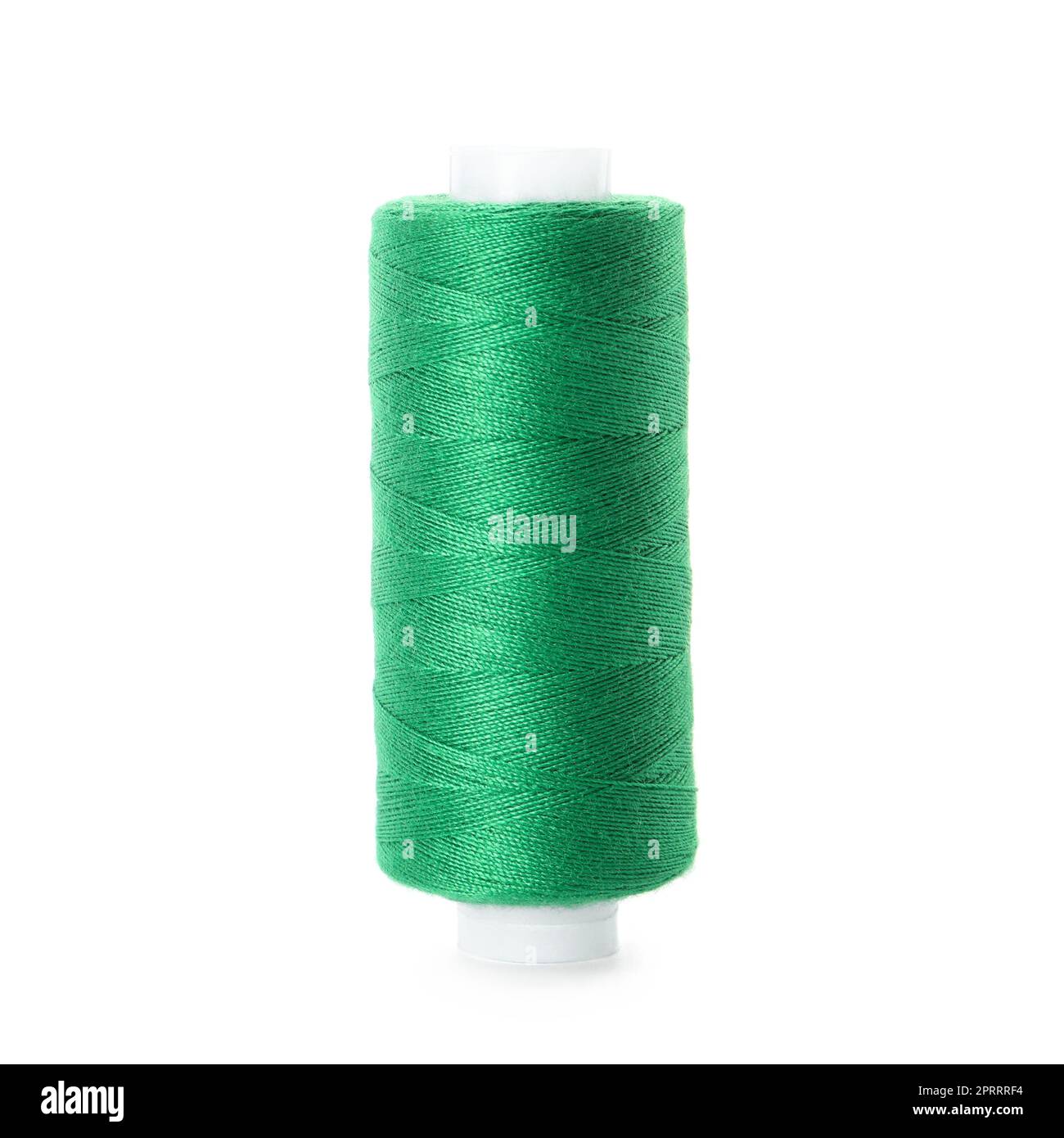 Spool of green sewing thread isolated on white Stock Photo - Alamy