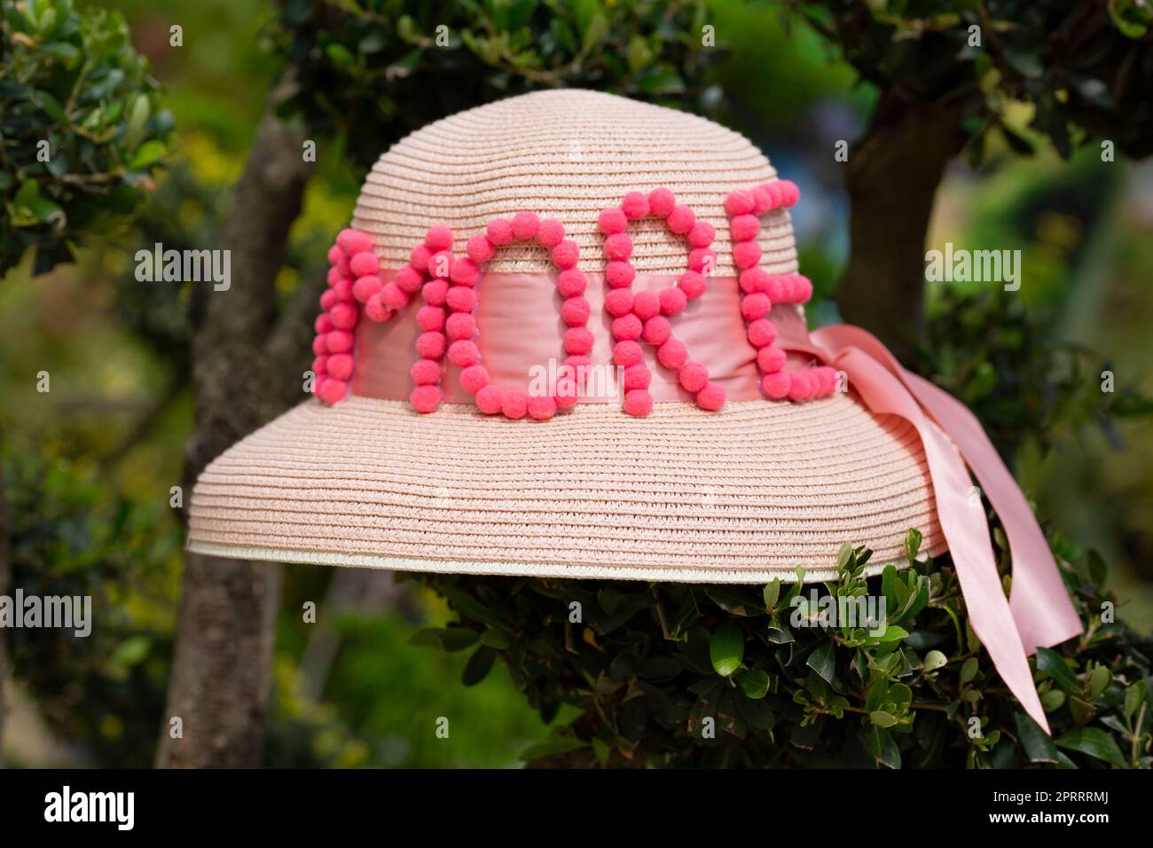 handmade straw hat with English writing Stock Photo - Alamy