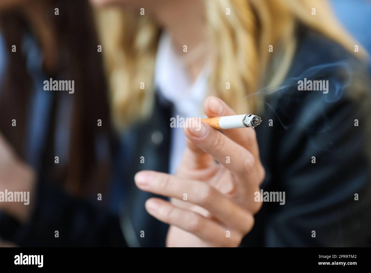 People smoking cigarettes at public place outdoors, closeup. Space for ...
