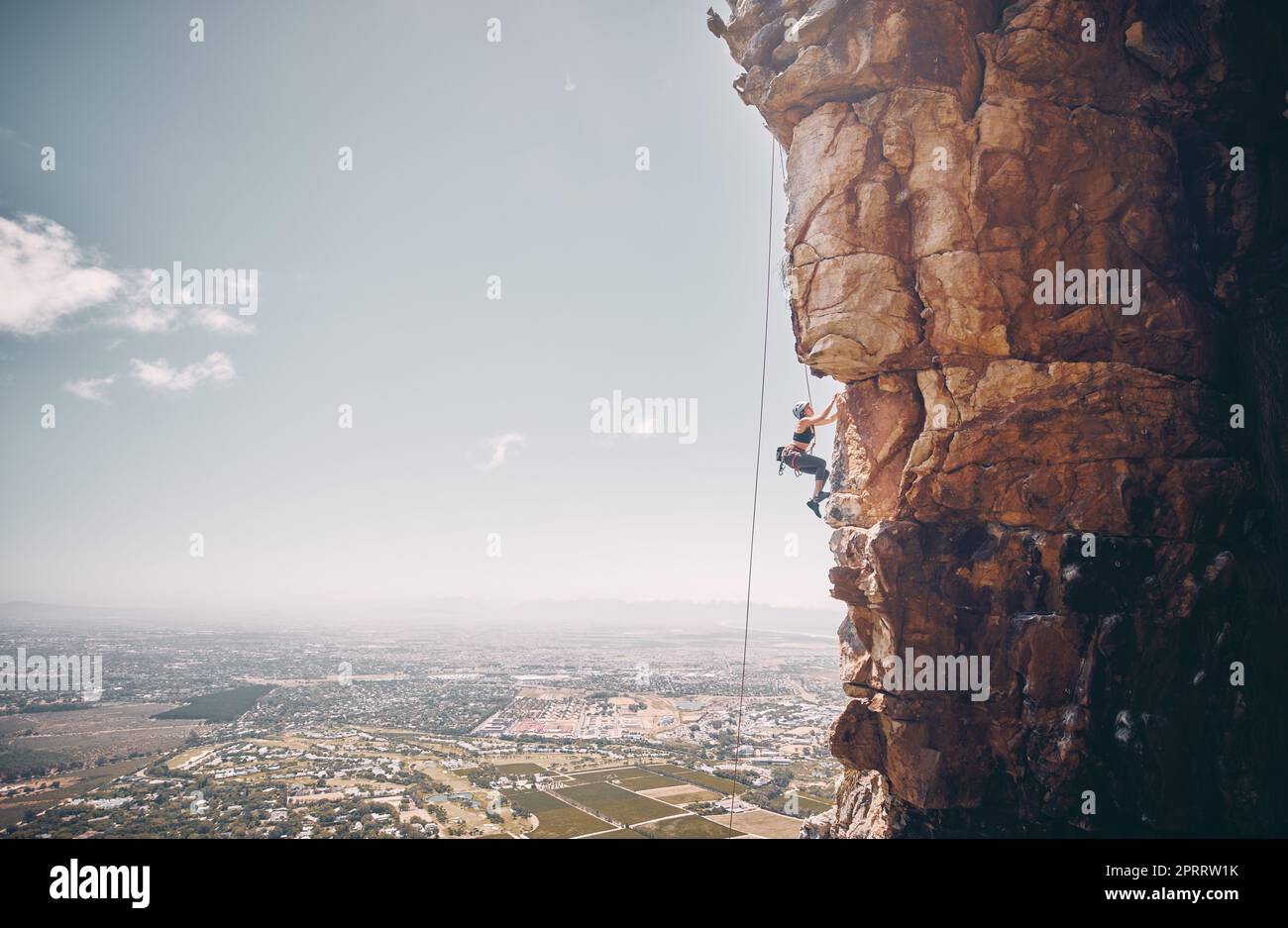 Mountain, rock climbing and sport with a sports woman and climber ...