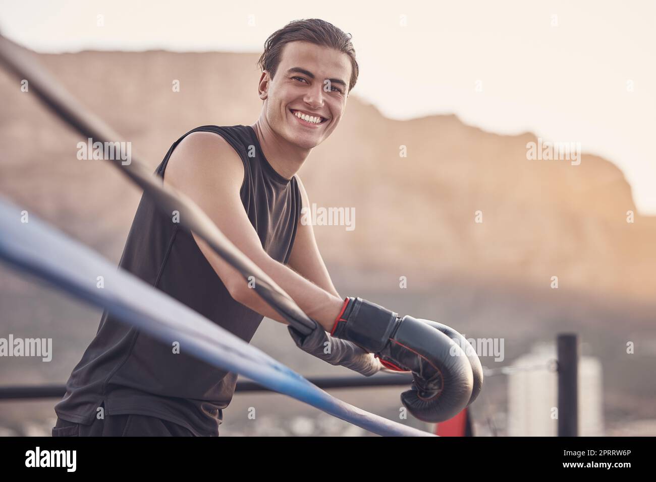Relax, boxing ring and portrait of man with gloves on break in outdoor ...