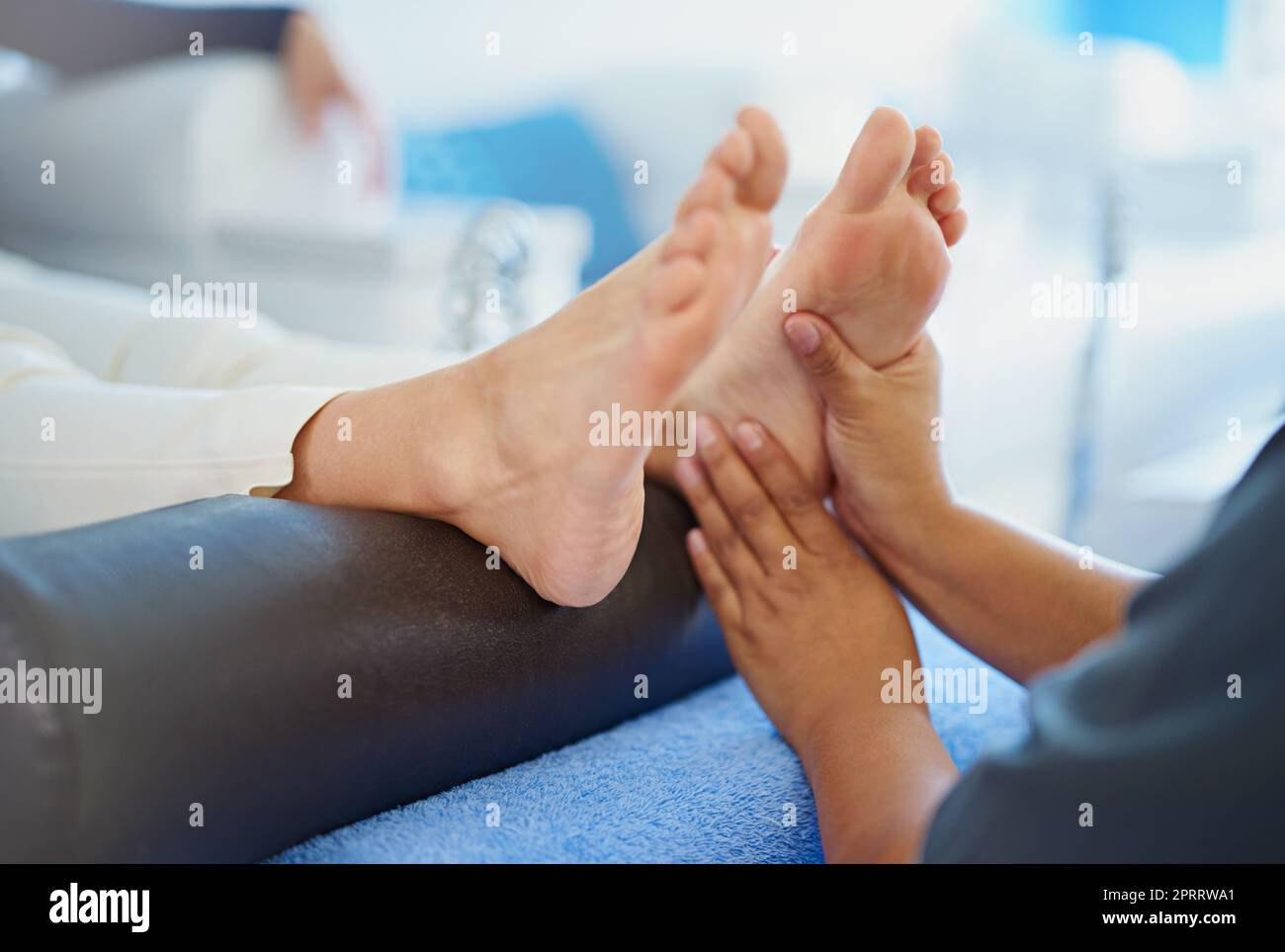 Woman massaging feet hi-res stock photography and images - Alamy