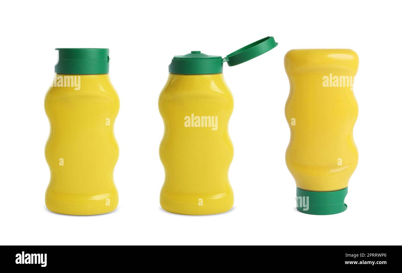 Set with spicy mustard in plastic bottles on white background Stock ...