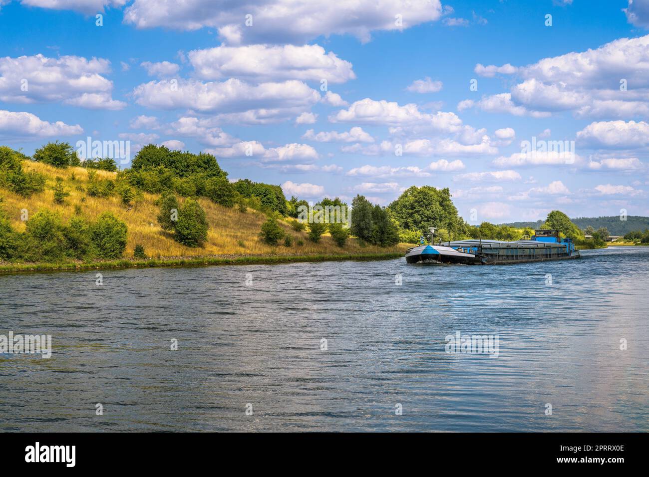 Barge on the Rhine–Main–Danube Canal in an idyllic valley (Bavaria ...