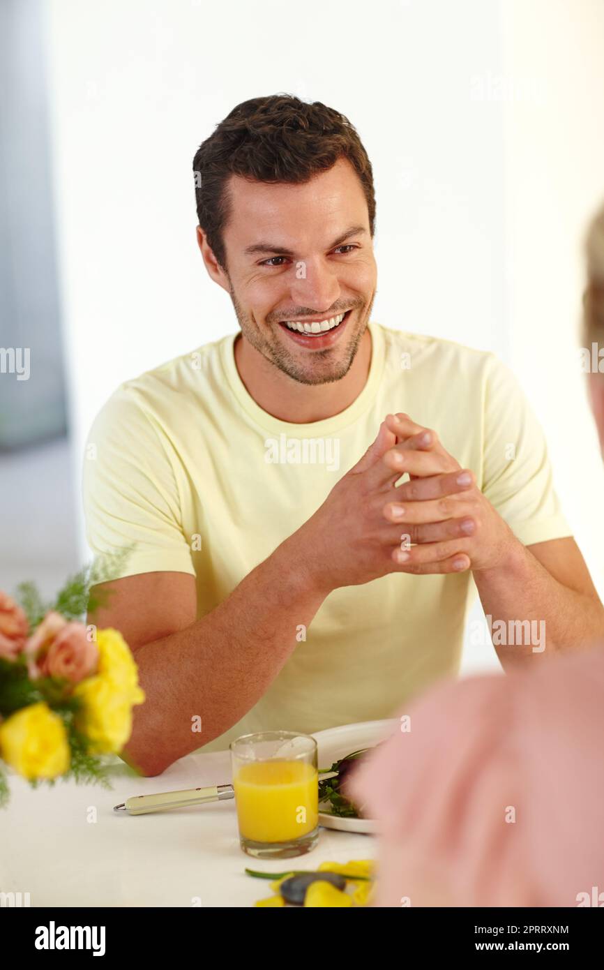 Good food and great company. A handsome man enjoying a healthy lunch ...