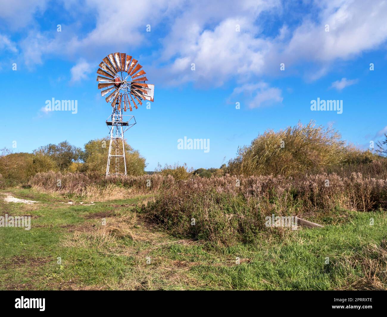 Rusty old wind pump at Wheldrake Ings Nature Reserve in North Yorkshire ...
