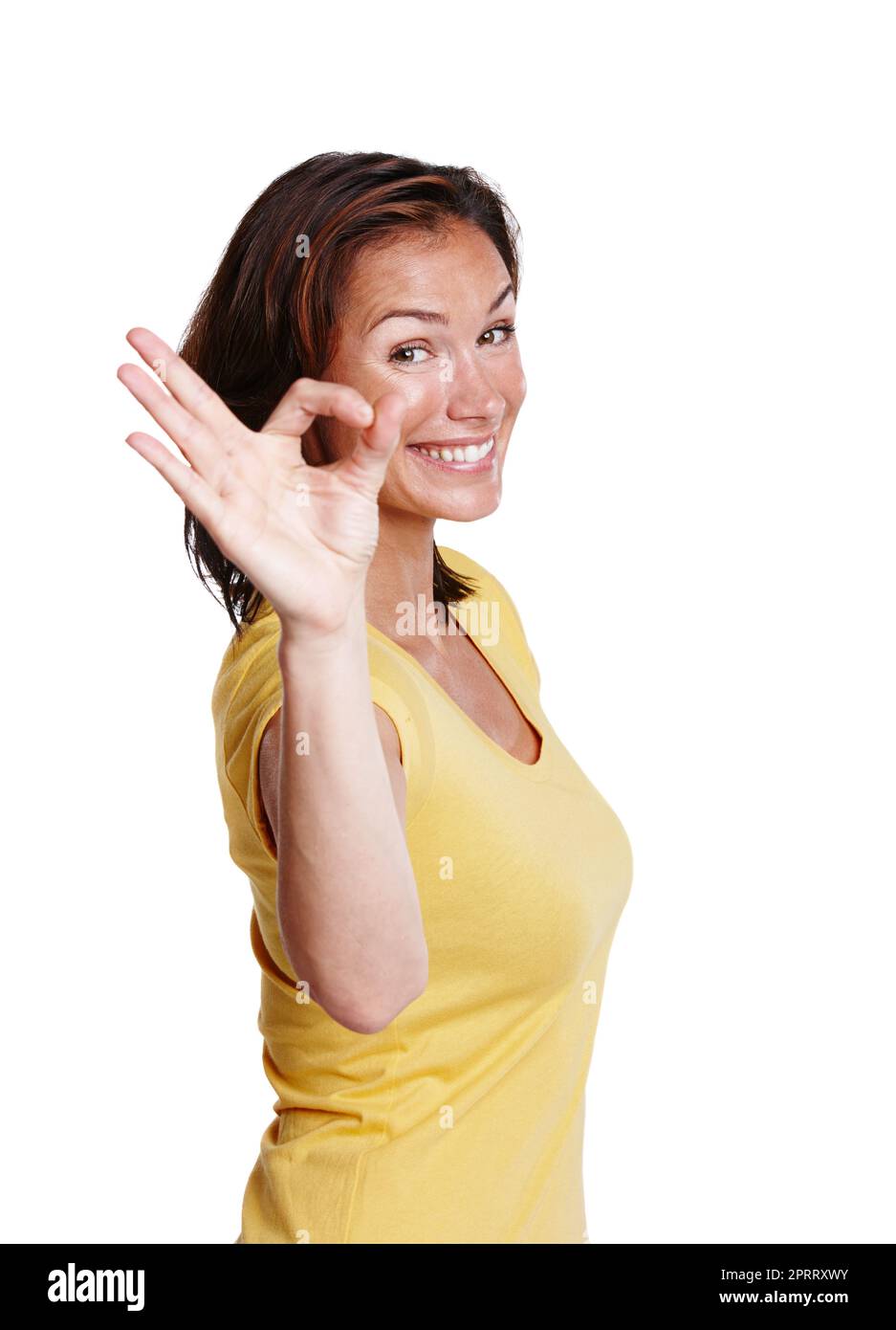 I say ok. Cropped studio shot of an attractive woman in her 30s showing ...