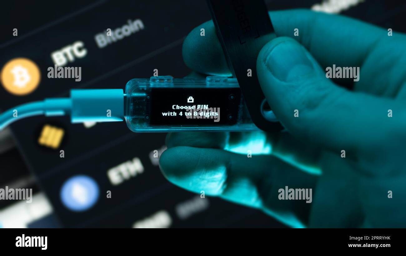 Focus on the screen of an hardware wallet Ledger, the Metamask logo in ...