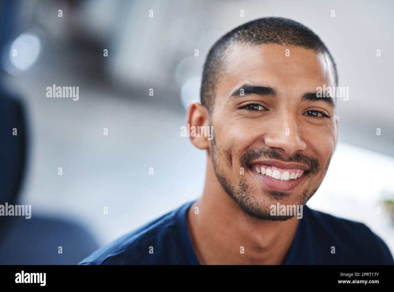 Make creativity a job. Portrait of a young designer at work on his ...