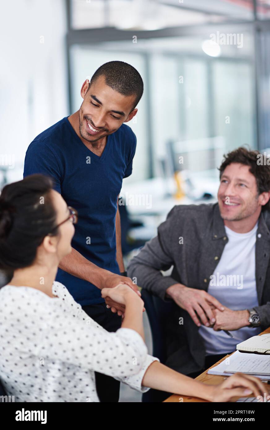 Young employees talking hi-res stock photography and images - Alamy