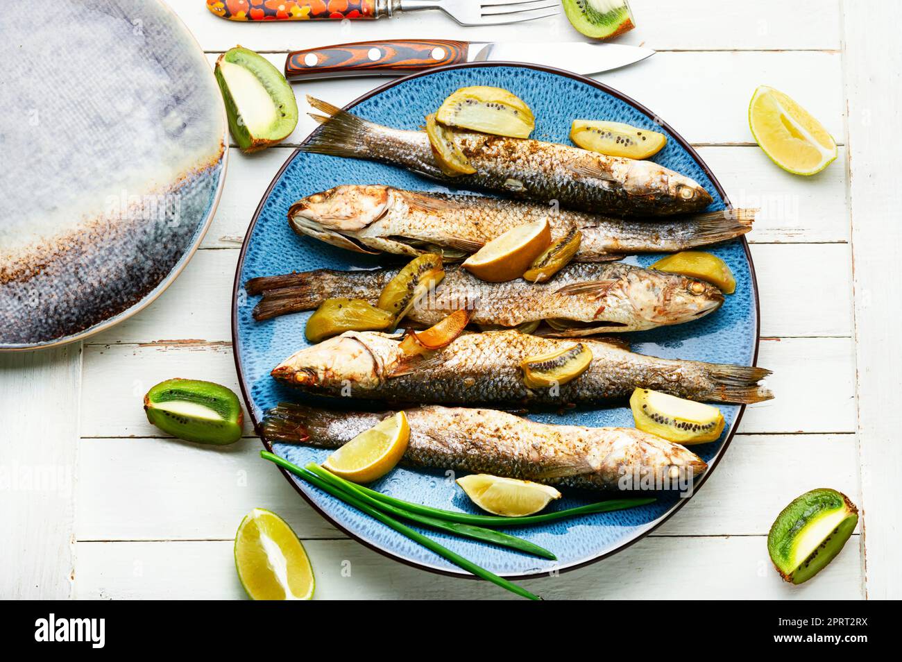 Baked fish pelengas Stock Photo - Alamy