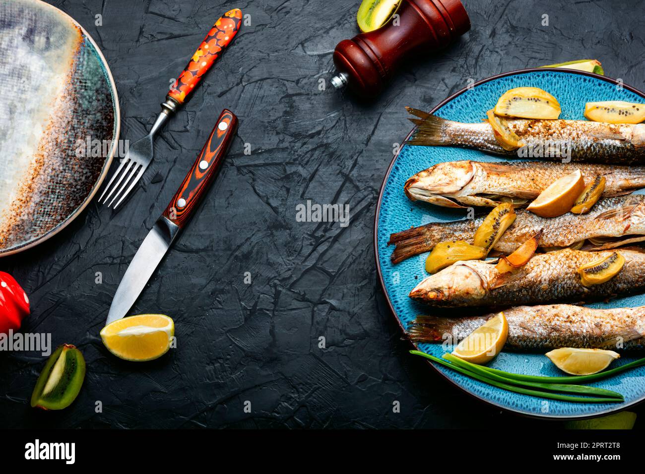 Baked fish pelengas Stock Photo - Alamy