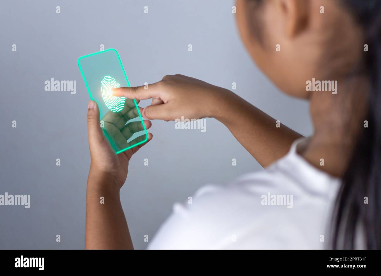 People's fingers are pressing on the phone screen. Represents ...