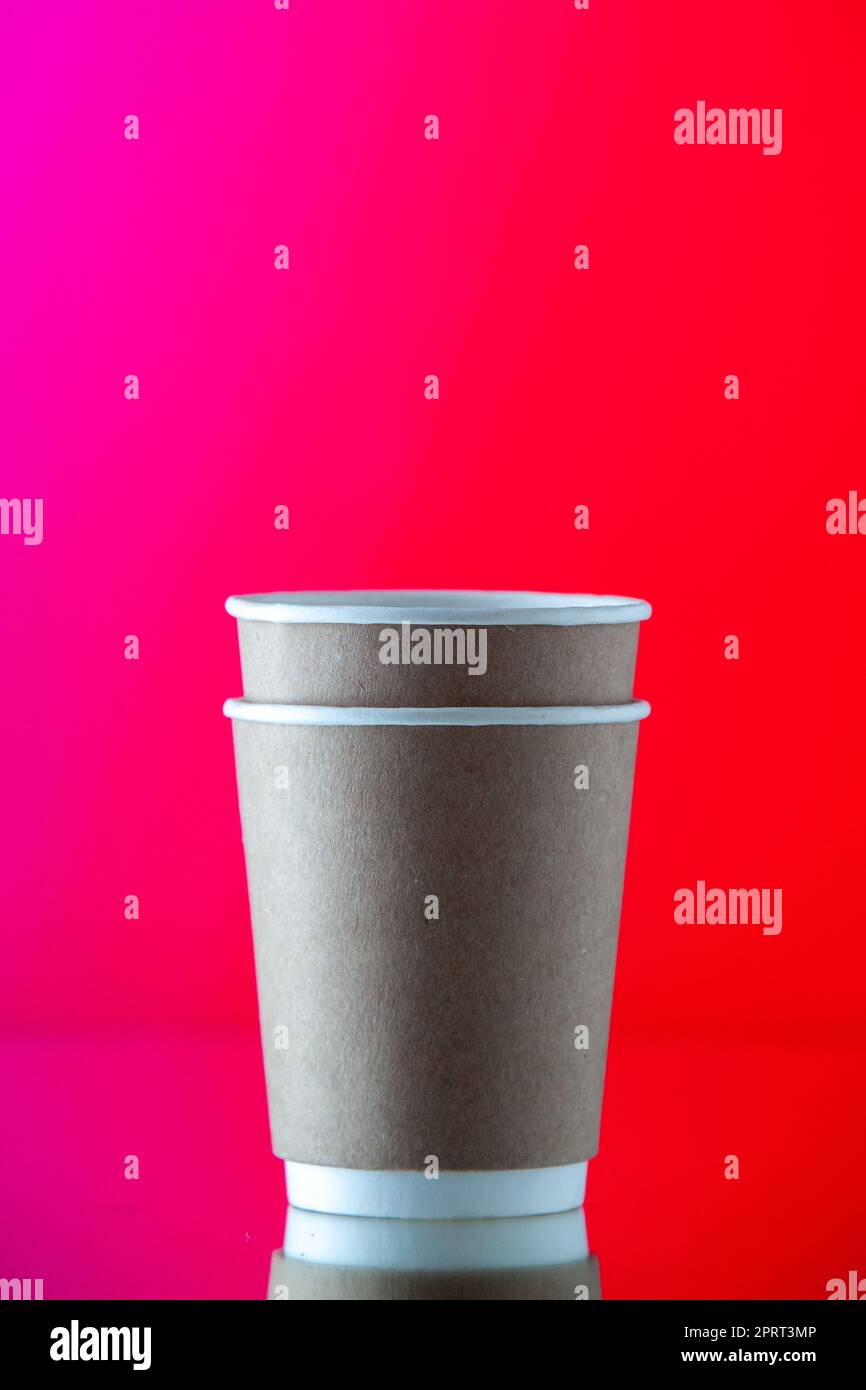 front view stuck up paper water cups on light red background Stock ...