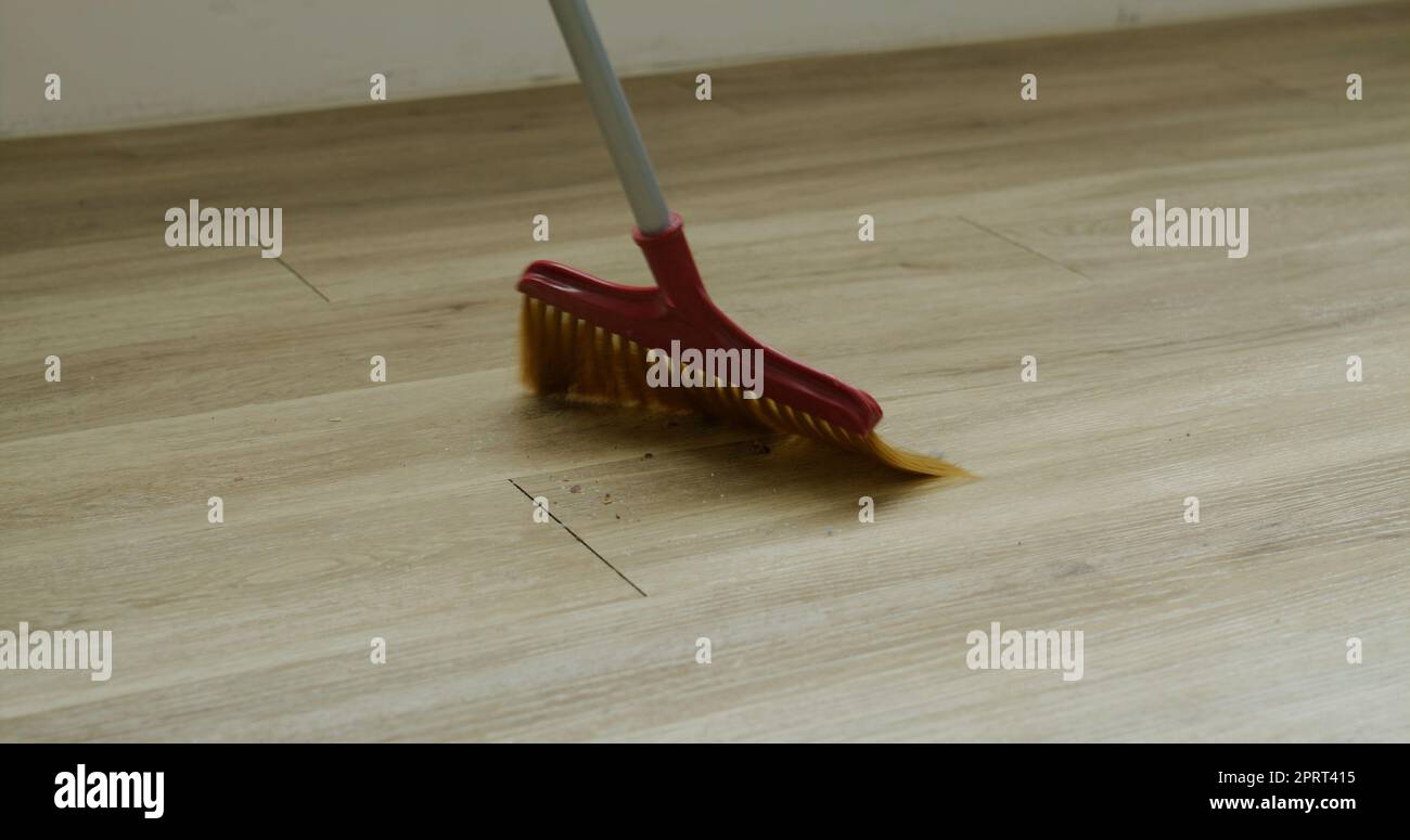 Sweep the floor at home Stock Photo - Alamy