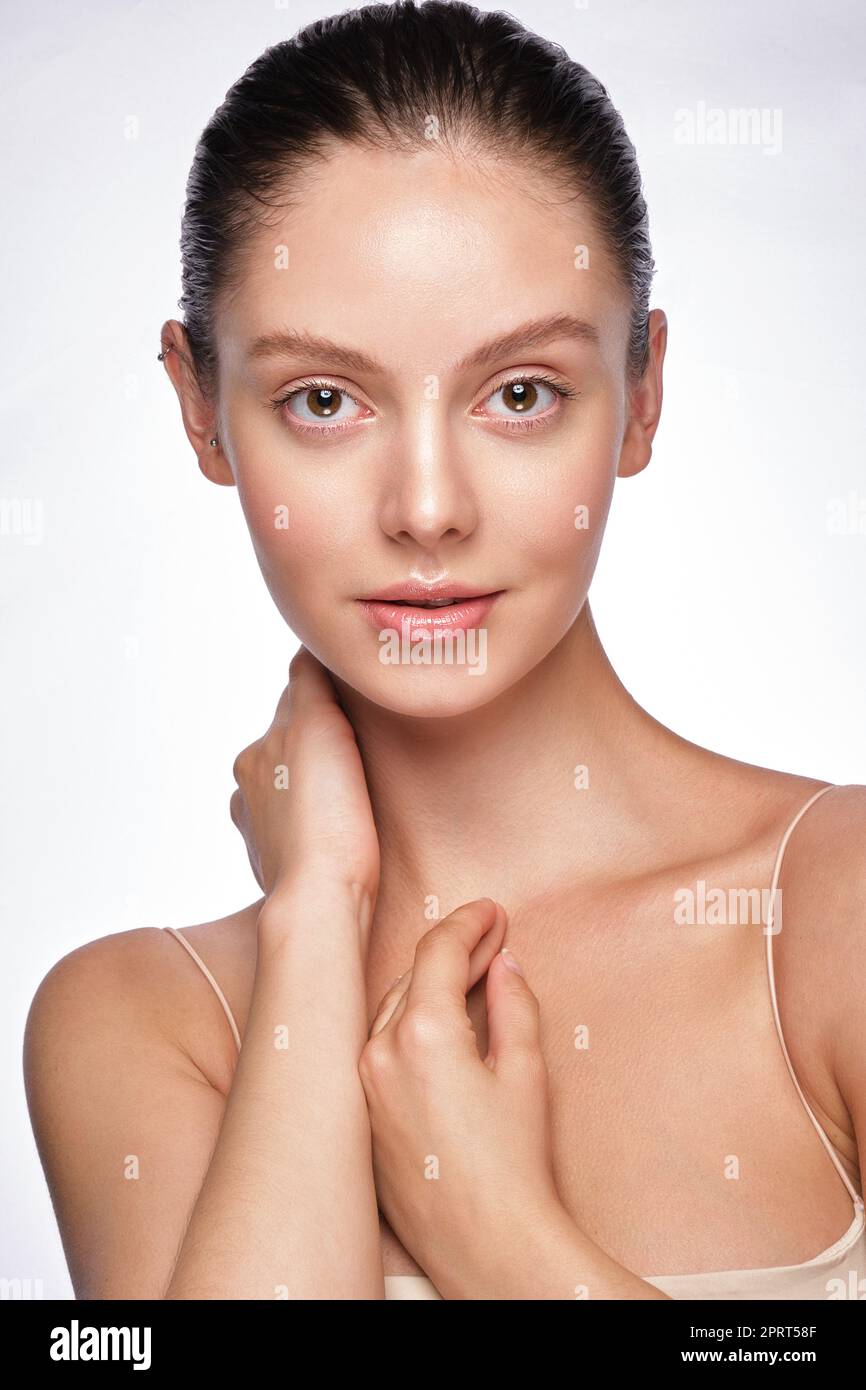 Portrait of beautiful woman with light natural make-up and perfect skin ...