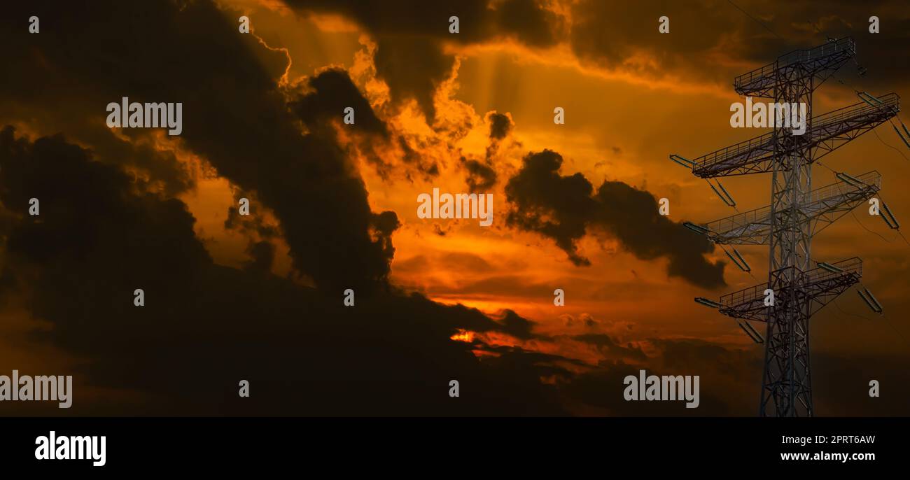 High-voltage tower with electric wires in the rays of sunset. High ...
