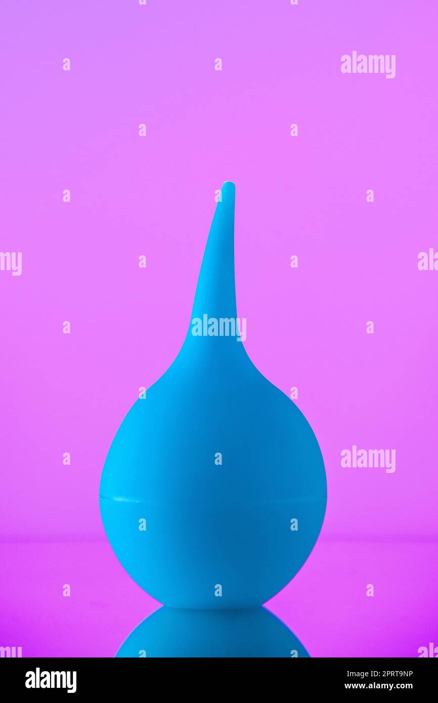 front view rubber bulb syringe on pink background Stock Photo - Alamy