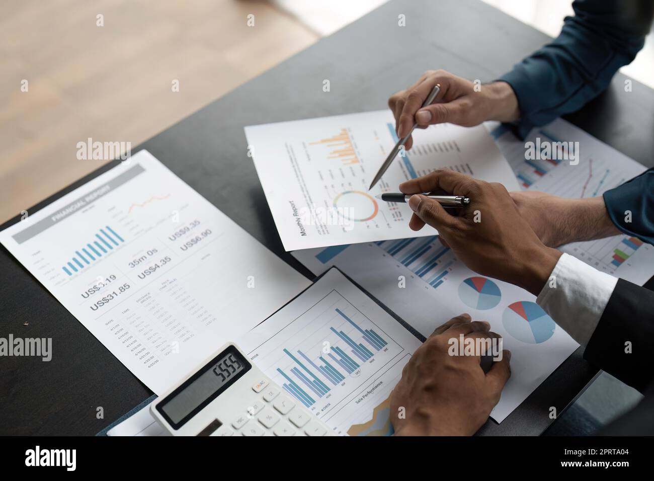 Meeting business team advisor about financial graph chart showing ...