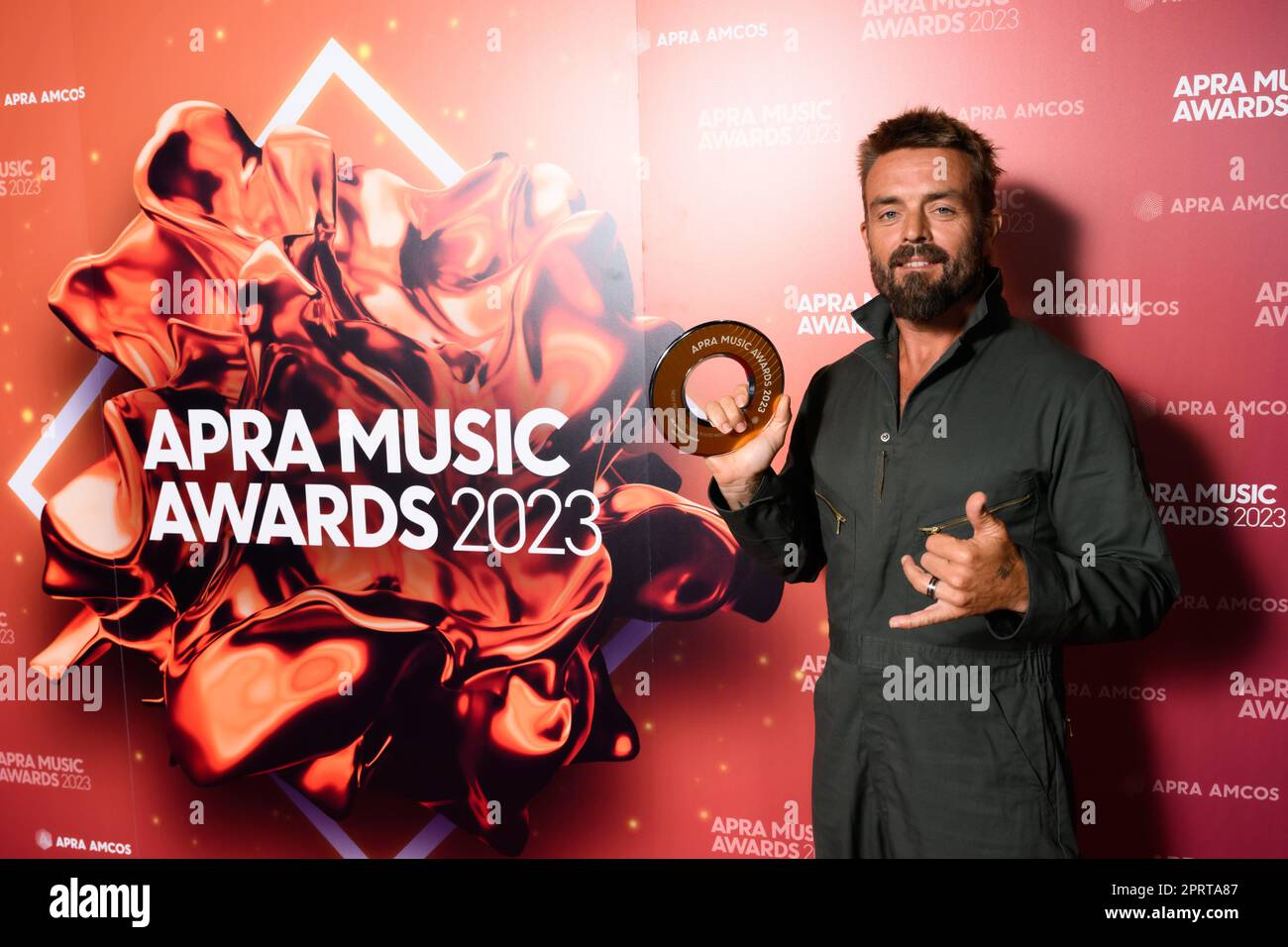 Xavier Rudd holds his APRA Award for Most Performed Blues and Roots Work at the 2023 APRA Music ...