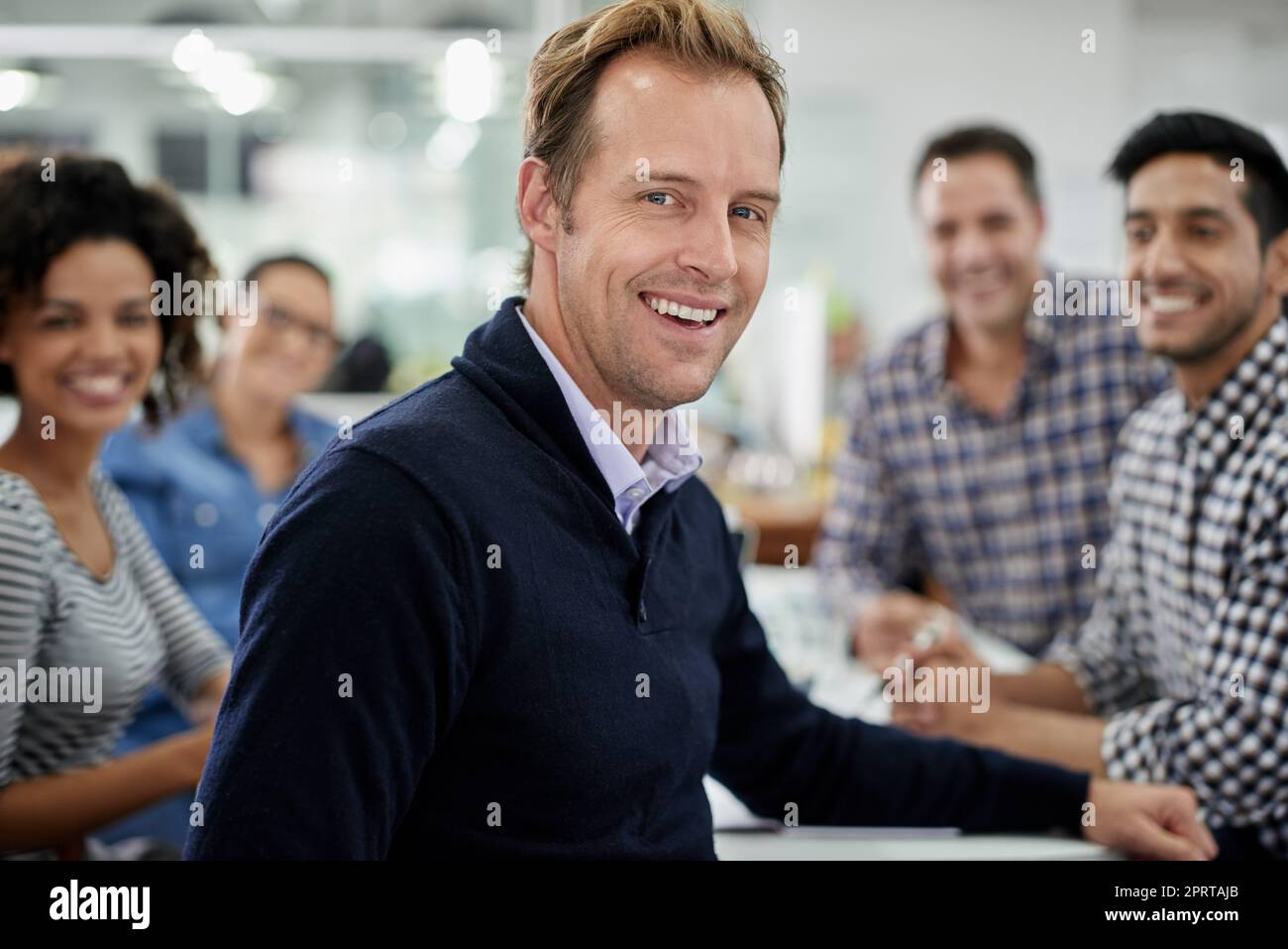 Strong and efficient leader. Smiling businessman looking towards the ...