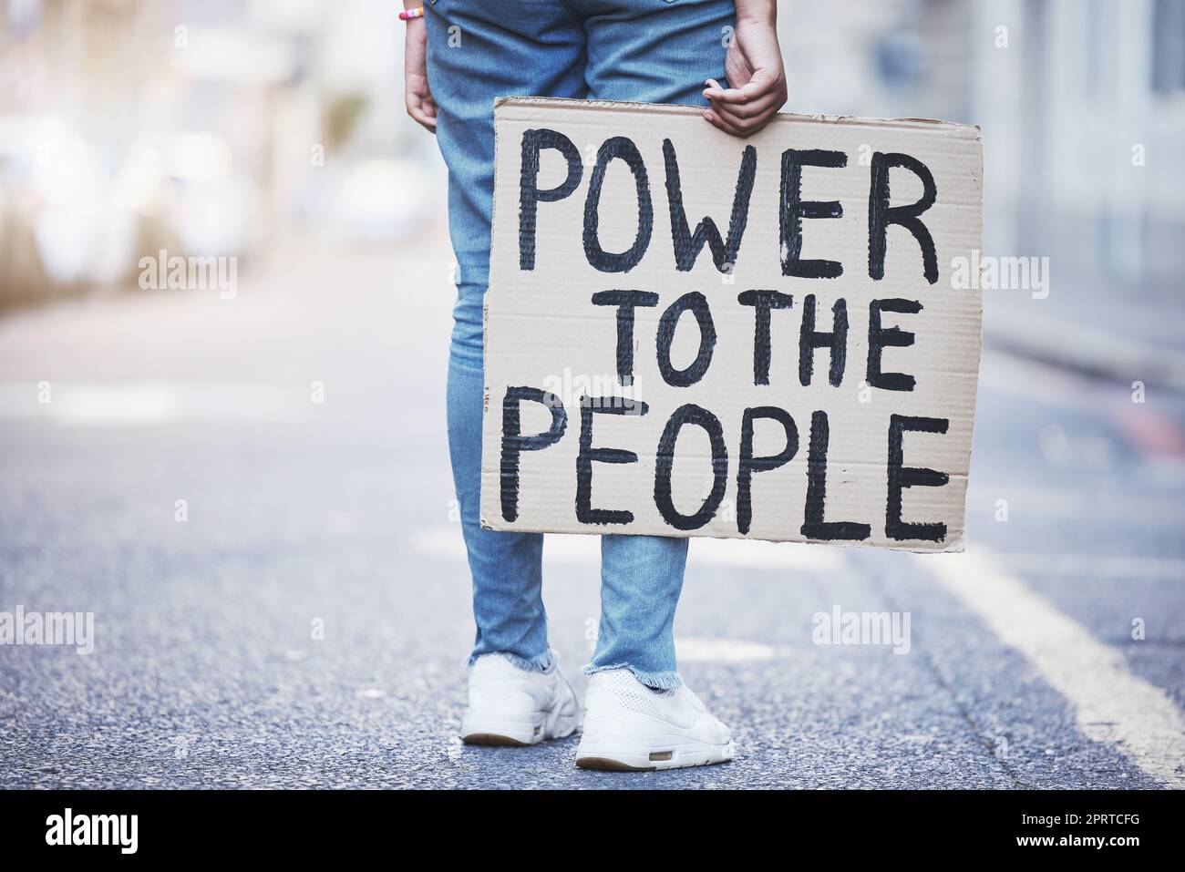 Power to the people cardboard protest poster in a city street for ...