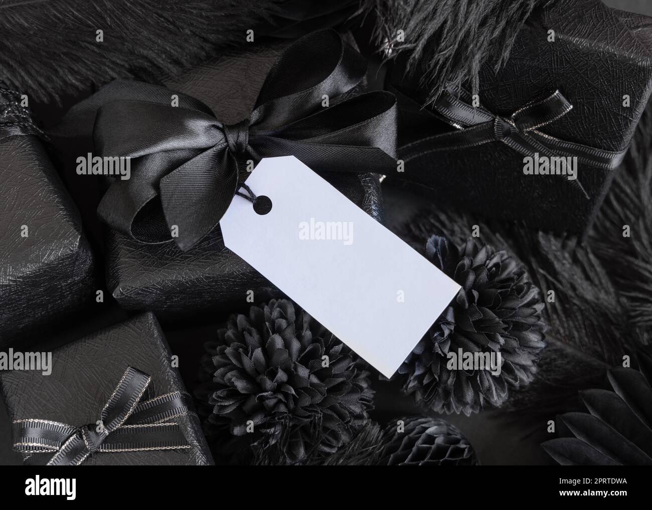 Wrapped Gift Boxes with black paper flowers and decorations and ...