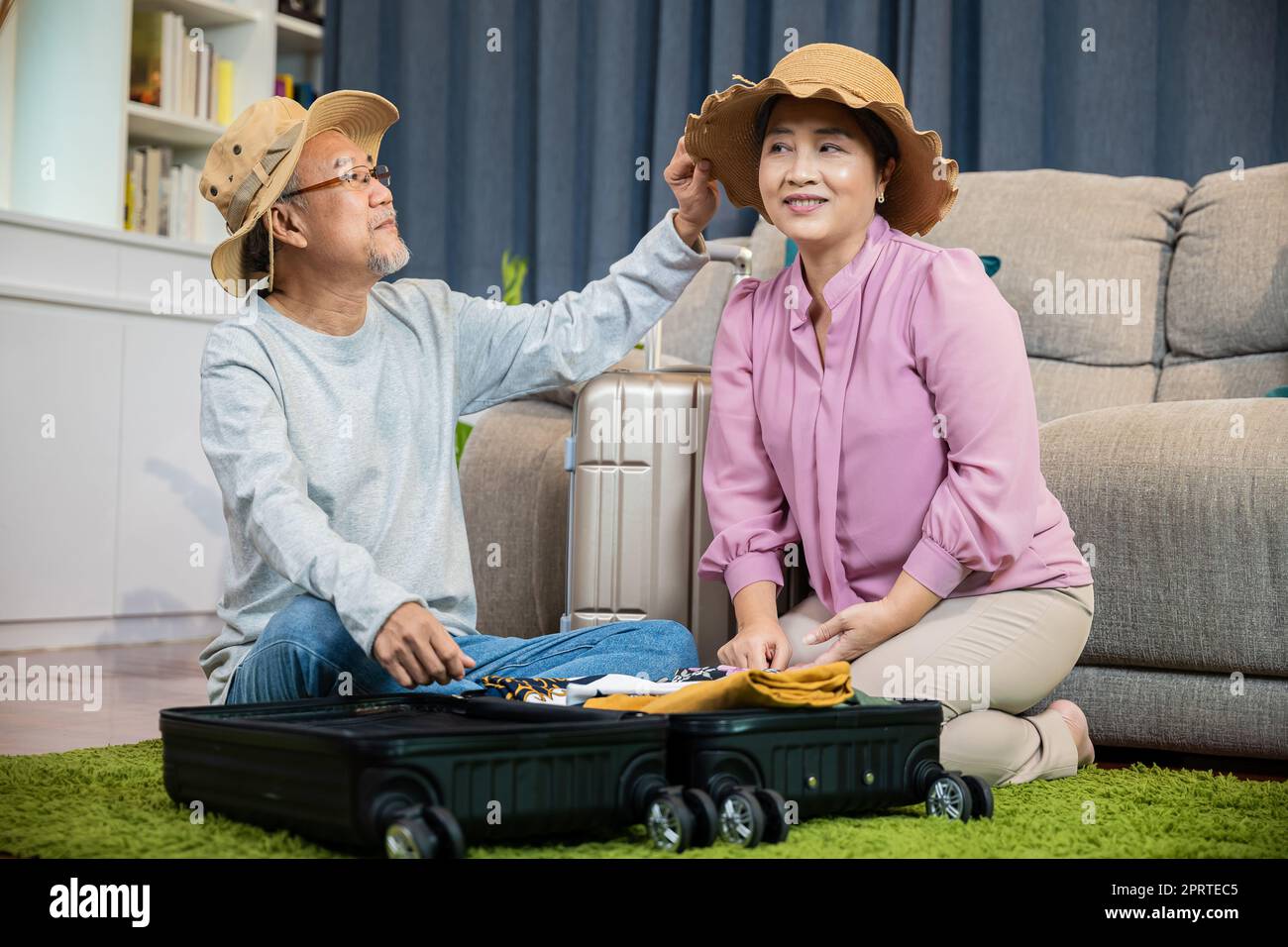 Mature woman packing holiday bag hi-res stock photography and images - Alamy