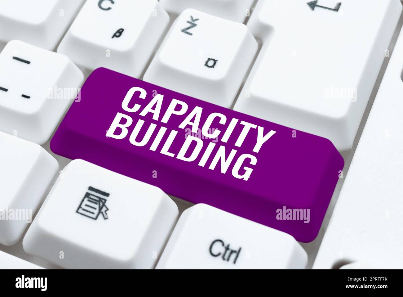 Text sign showing Capacity BuildingStrengthen the abilities of ...
