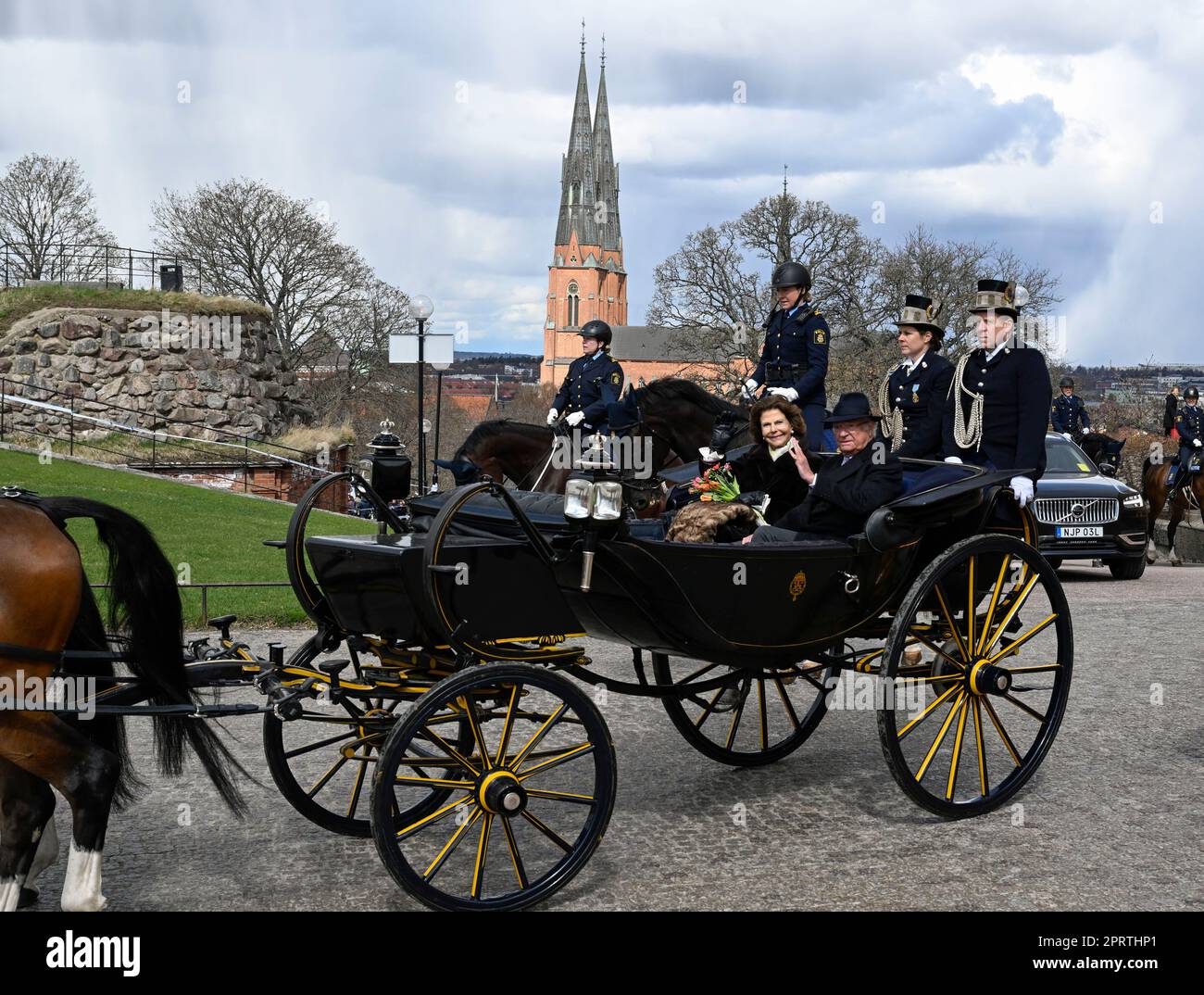 Sweden's King Carl XVI Gustaf and Queen Silvia ride in a horse drawn ...