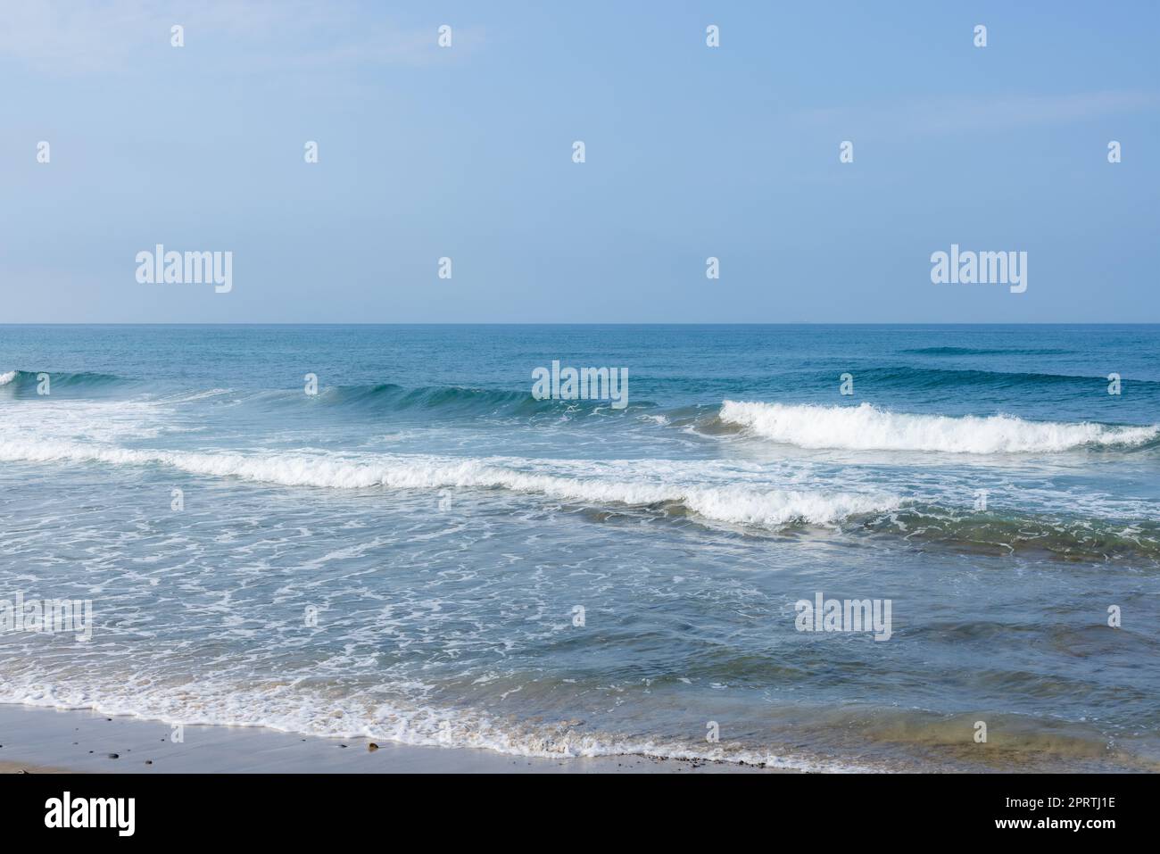 Sea wave splash over the beach Stock Photo - Alamy