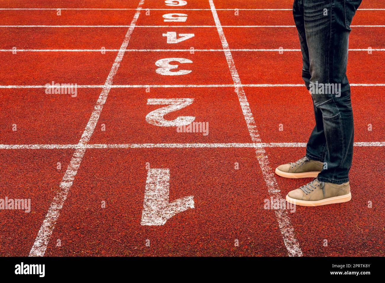 Man standing at the white line on track number one Stock Photo - Alamy