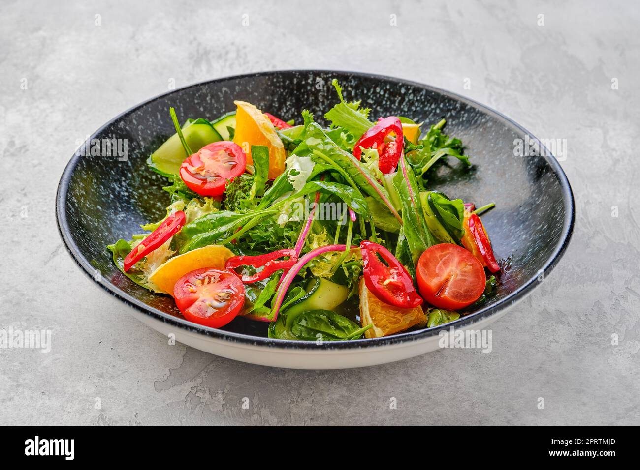 Spicy salad with orange, chilli, tomato, cucumber and avocado Stock ...