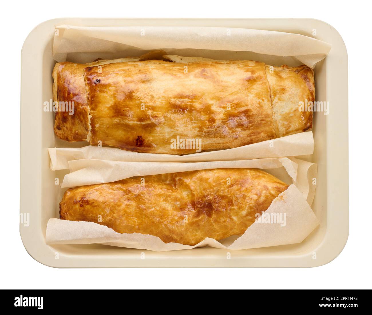 Baked strudel with apple filling in a rectangular pan isolated on white ...