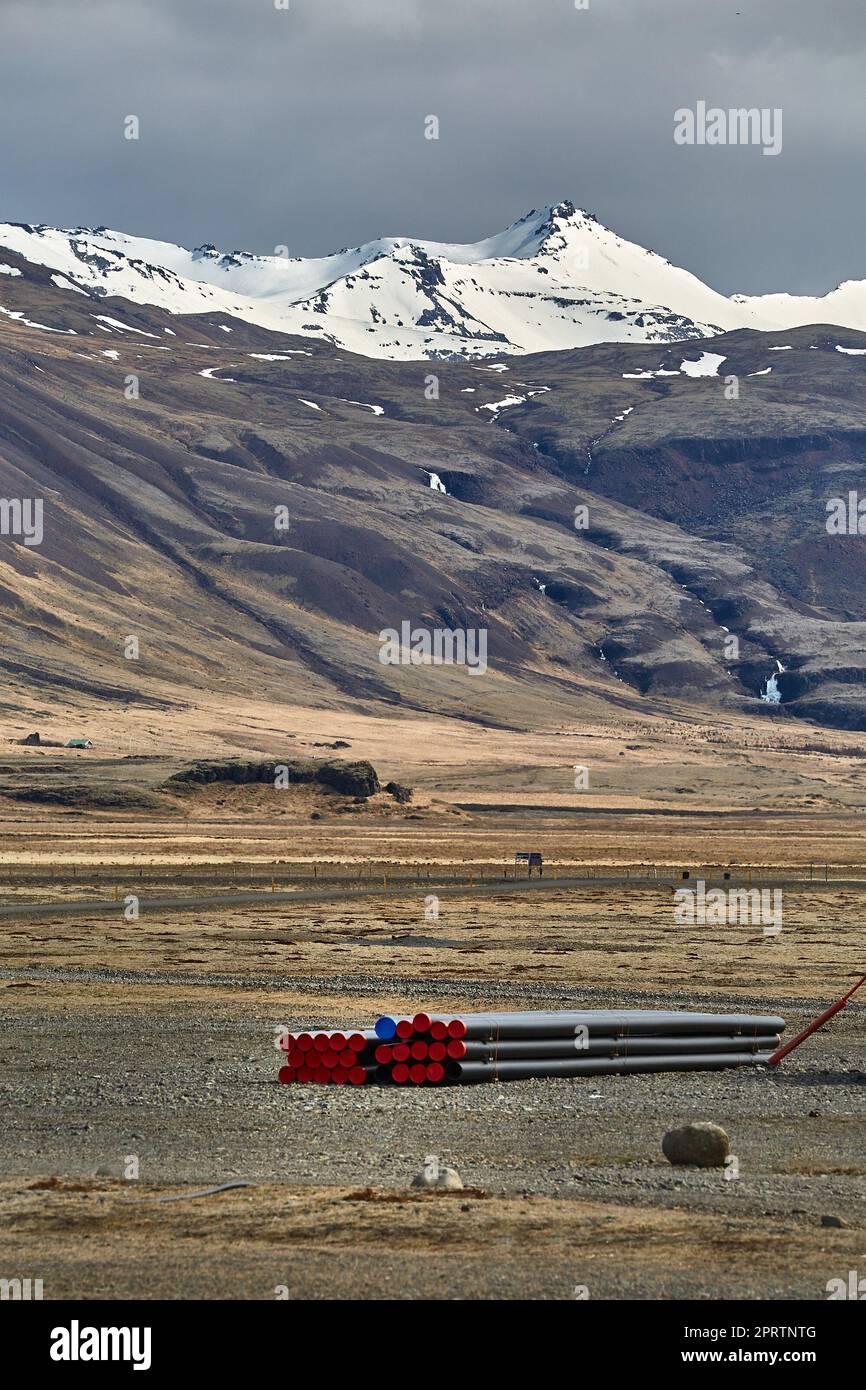 Iceland landscape with construction site for utility pipelines, tubes ...