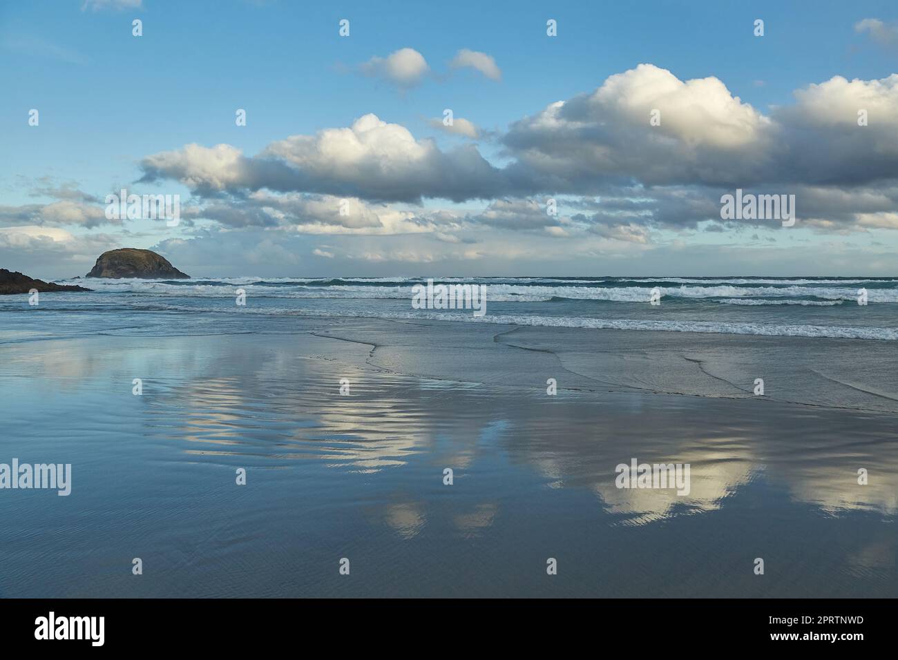 Sandy beach landscape with cloud reflections in New Zealand Stock Photo ...