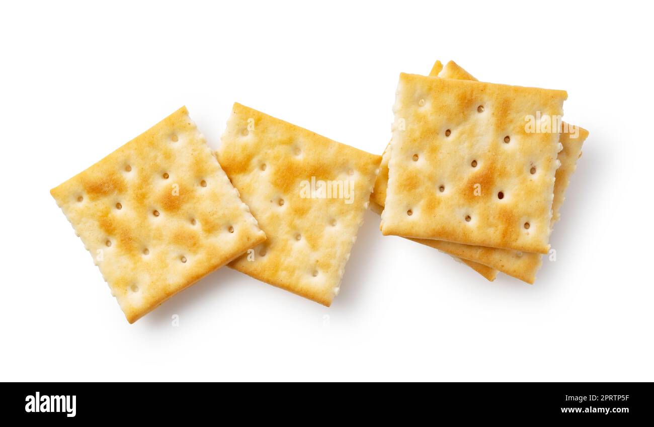 Crackers placed on top of each other on a white background. Viewed from ...
