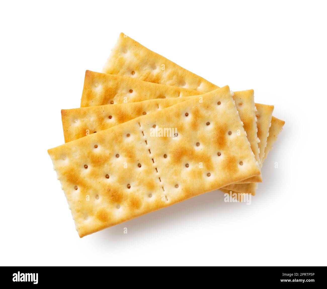 Crackers placed on top of each other on a white background. Viewed from ...