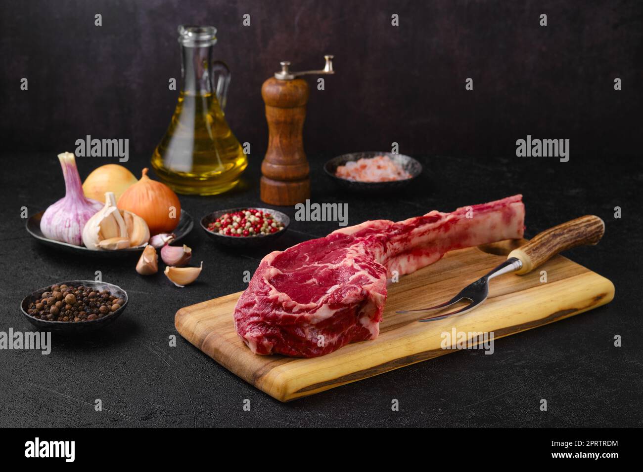 Raw beef cowboy steak with spice ready for cooking Stock Photo - Alamy