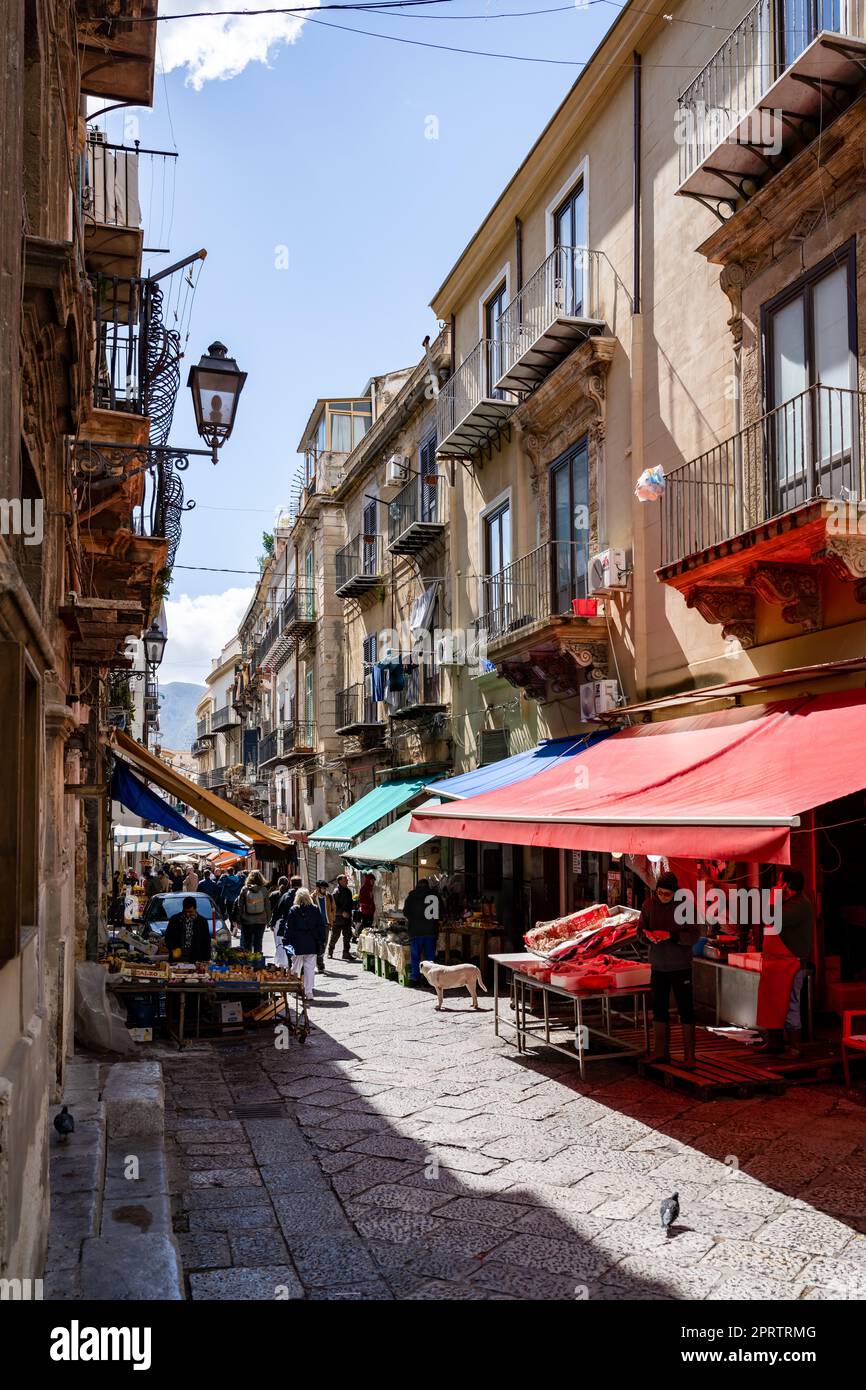 A market in a historic street in Palermo with many covered market ...