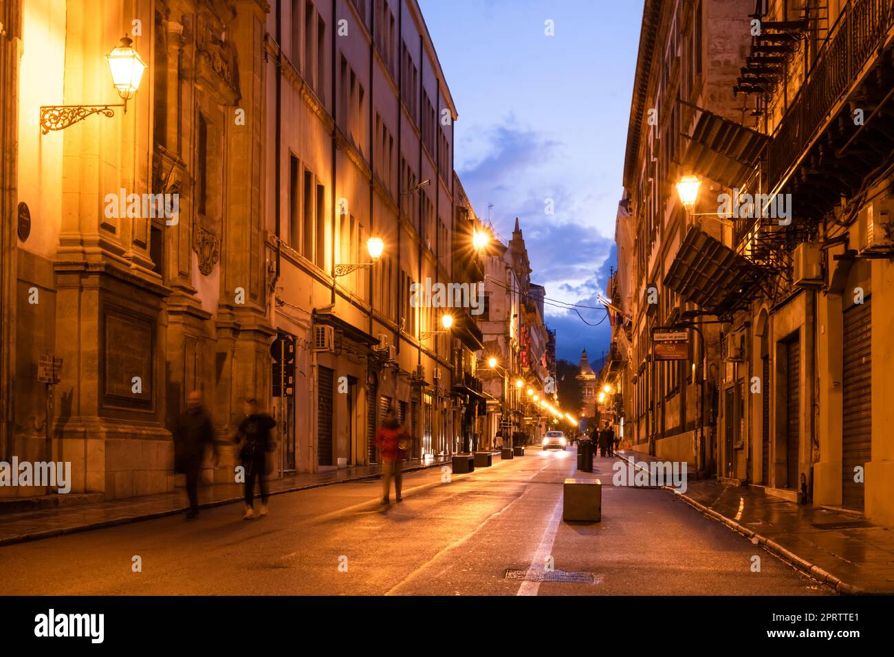 Evening twilight at the Via Vittorio Emanuele in historic Palermo where ...