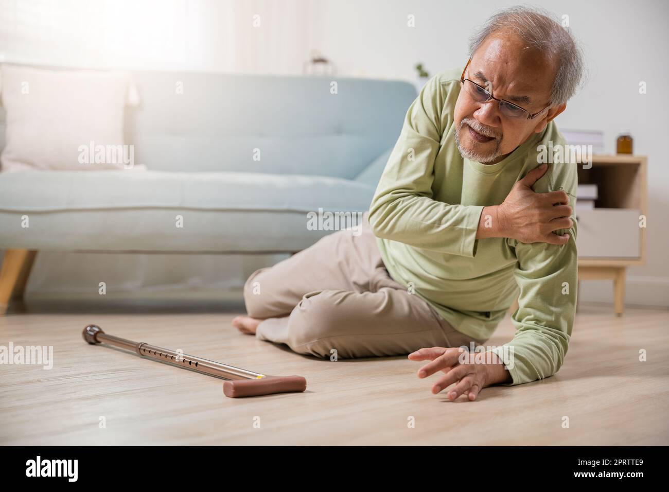 Sick senior old man falling down lying on the ground because stumbled ...